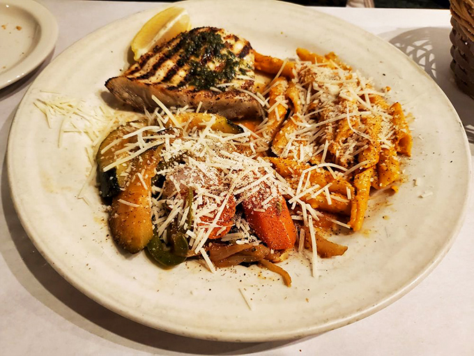 A plate that captures California on a dish—grilled fish, vibrant vegetables, and pasta that would make an Italian grandmother weep with joy.