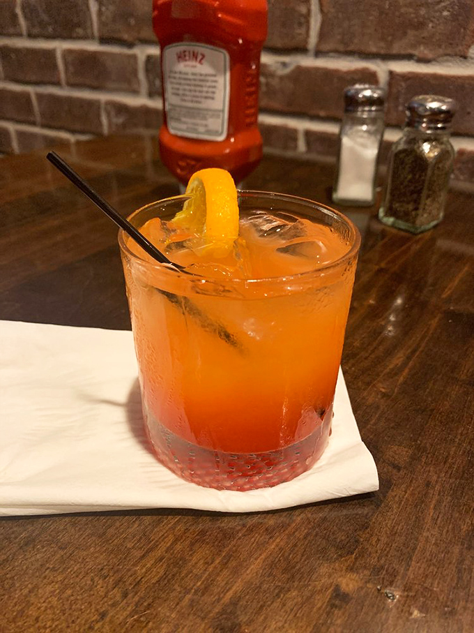 A sunset in a glass – this tequila sunrise cocktail provides liquid courage before tackling that massive menu.