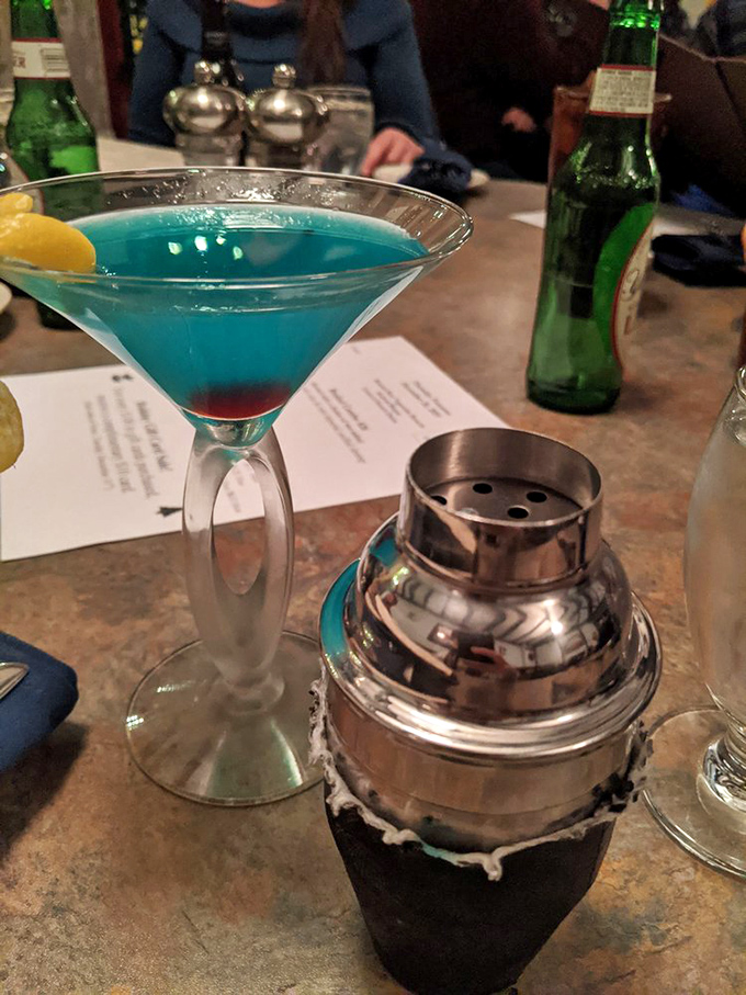 That electric blue martini isn't just a drink, it's a conversation starter that says "yes, we're hundreds of miles from the ocean, but we're celebrating anyway."
