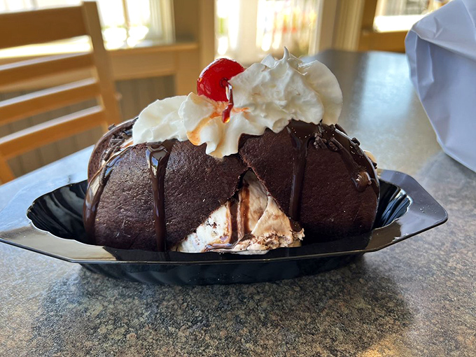 The ice cream sundae that launched a thousand diets—and was worth breaking every single one. That chocolate dome is basically Willy Wonka's summer home.