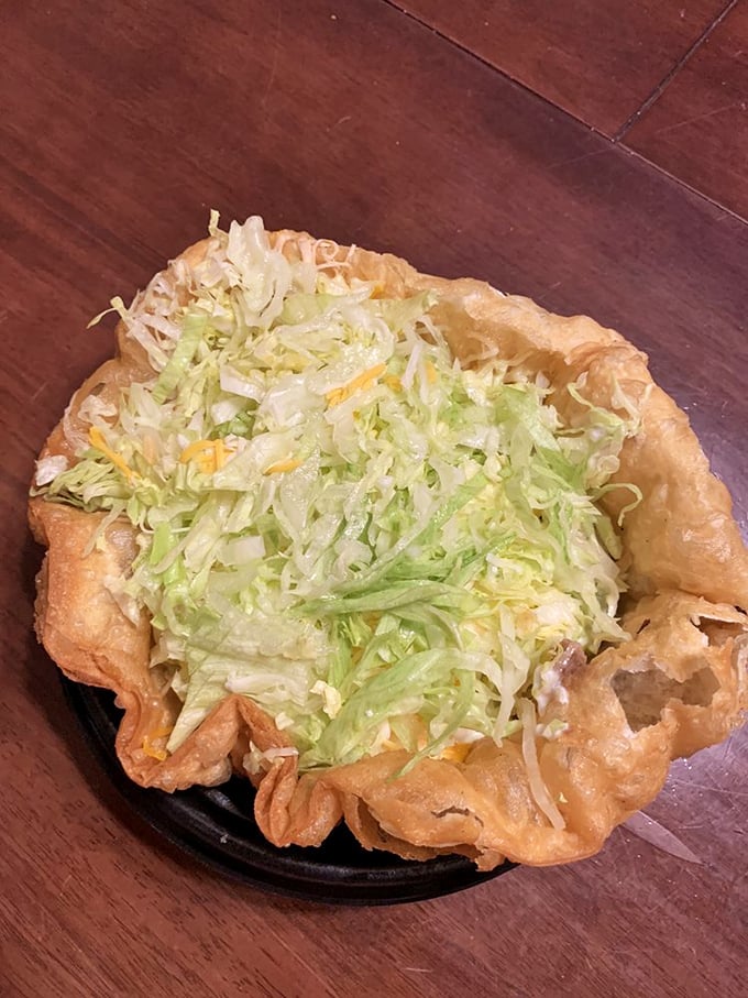 The tostada grande isn't messing around—a crispy foundation supporting a skyscraper of toppings that requires both strategy and appetite.