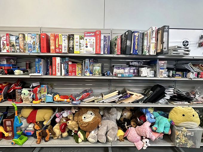 Board games, stuffed animals, and childhood memories waiting to be rediscovered – nostalgia priced by the pound and stacked with care. 