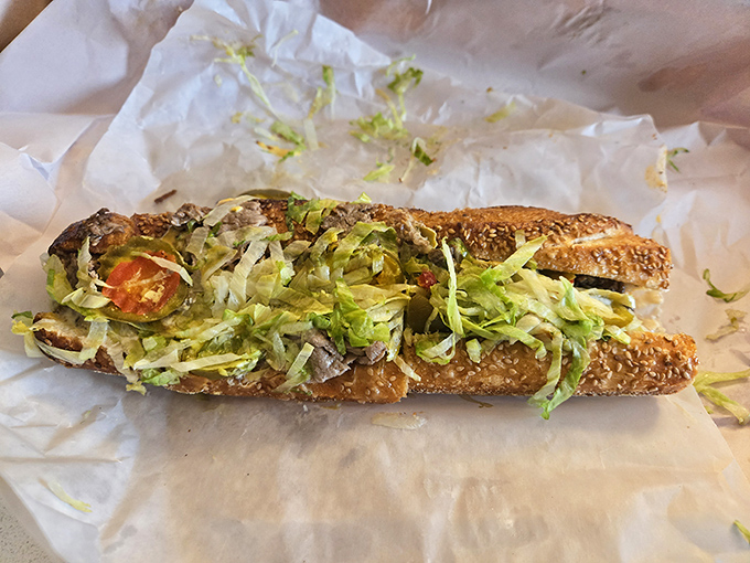 This hoagie is architectural perfection—a cathedral of lettuce, tomato, and thinly sliced meat. The shredded lettuce adds that essential texture that ties everything together.