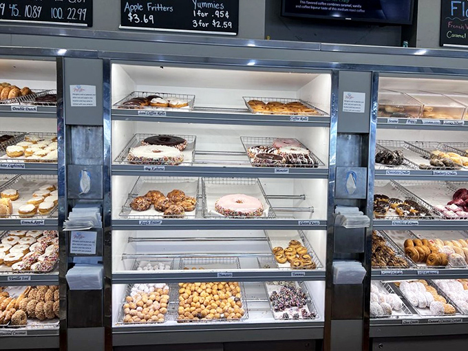 The display case at Yum Yum isn't just a showcase – it's a museum of edible art where each shelf tells a different chapter in the story of breakfast bliss.