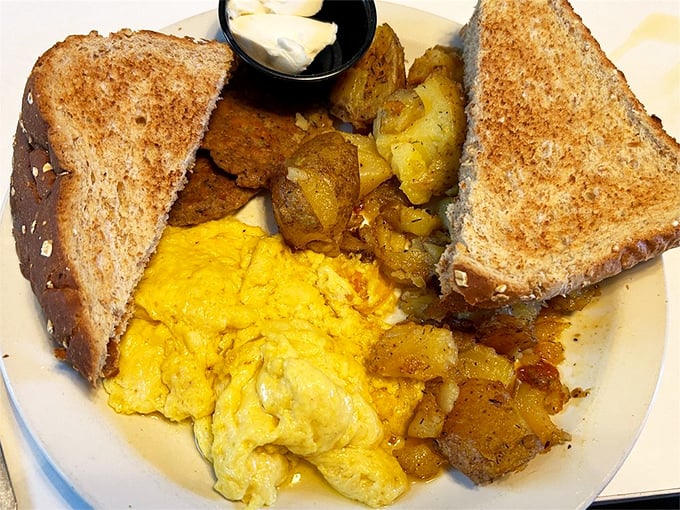 Morning sunshine on a plate – golden pancake, vibrant vegetables, and perfectly roasted potatoes that prove breakfast is the most important art form of the day.