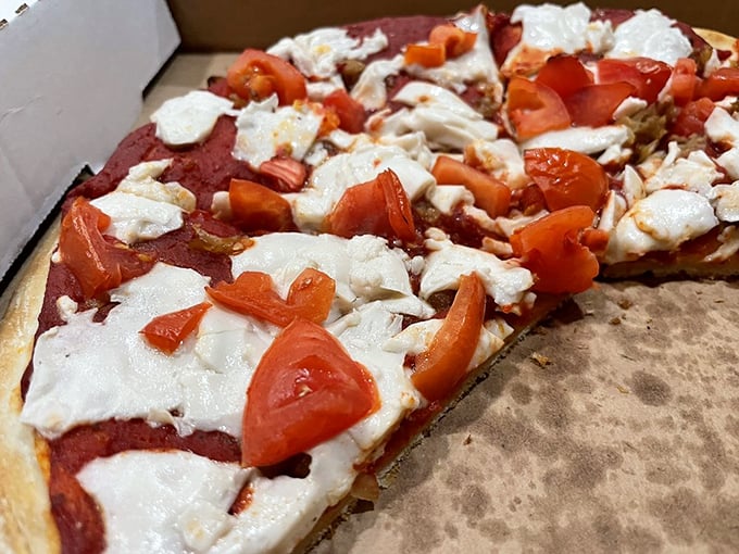 Fresh tomatoes and vegan cheese prove that plant-based pizza isn't just possible—it's downright craveable for herbivores and carnivores alike.