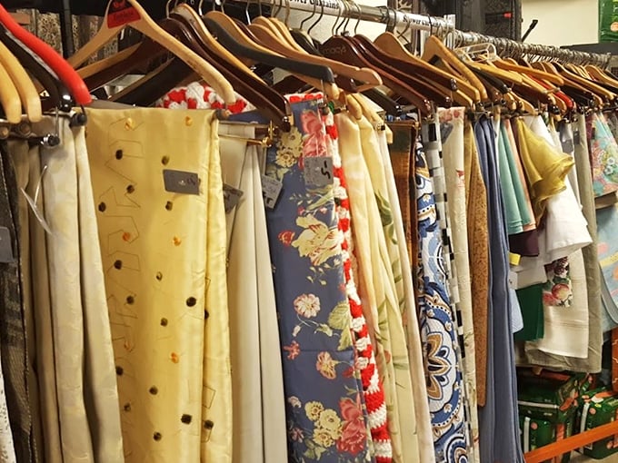 Fabric treasures hanging like colorful flags of fashion past. Each pattern tells a story—some more loudly than others.