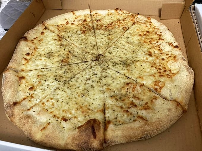 The white pie—garlic-kissed canvas of cheesy perfection. For those moments when tomato sauce feels like wearing a tuxedo to a backyard barbecue.