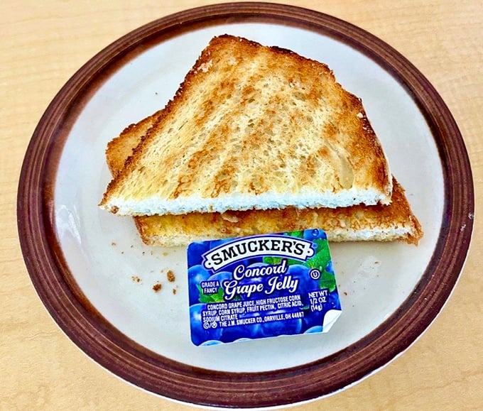 Sometimes the simplest pleasures are the best—golden toast with grape jelly, the breakfast equivalent of a comforting childhood memory.