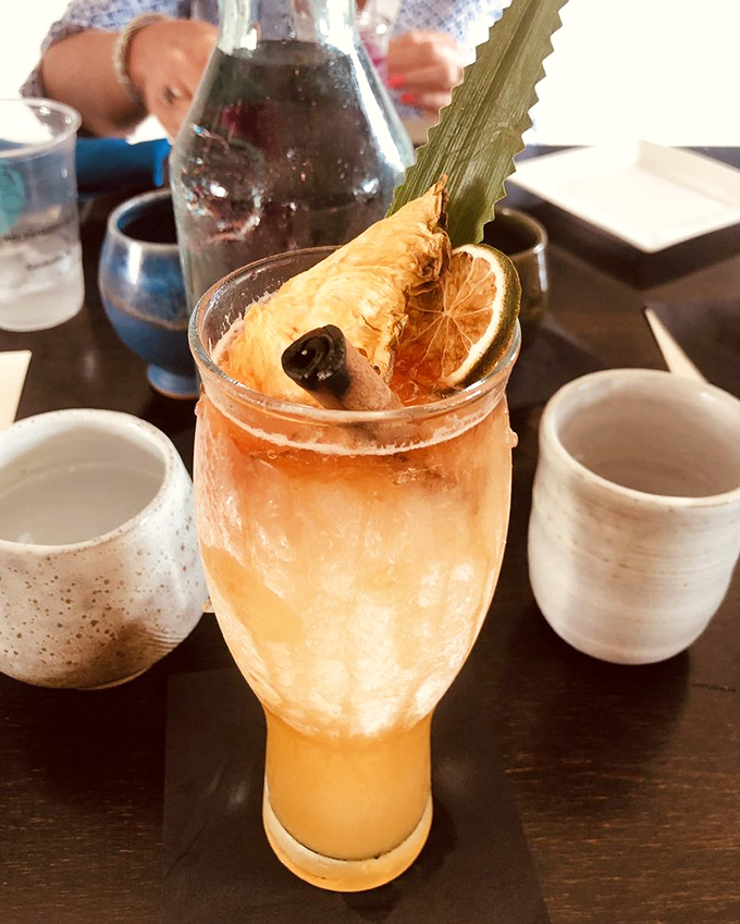 A cocktail that's part tropical vacation, part artistic statement—complete with garnishes that deserve their own Instagram account.