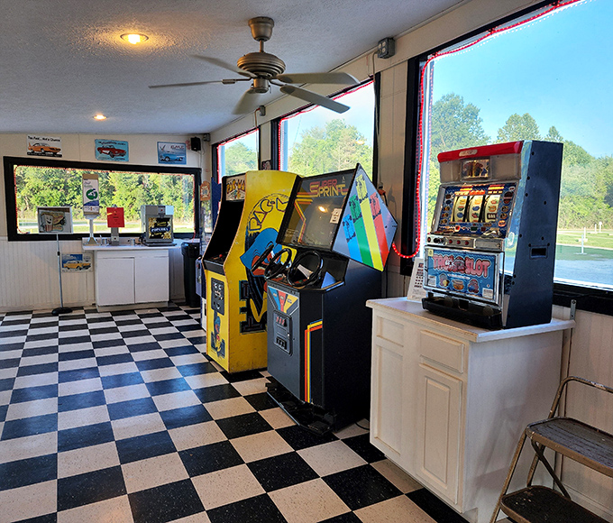 The arcade corner – where intermission transforms into a quick Pac-Man battle or pinball showdown before the second feature begins.