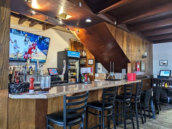 The bar area offers respite for weary travelers—wood-paneled warmth, cold drinks, and a TV that's probably showing either sports or local news. Arizona hospitality at its finest.