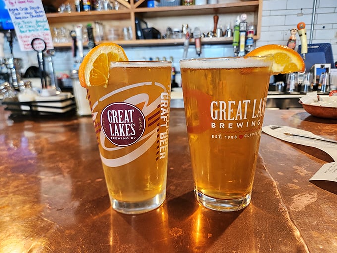 Great Lakes brews with orange slices perched on the rim – liquid sunshine in a glass after a morning of market exploration.