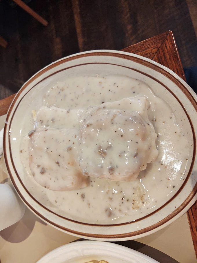 Biscuits swimming in creamy sausage gravy—the breakfast equivalent of a warm hug from your favorite Southern grandmother.