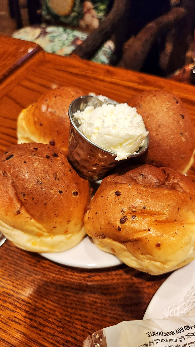 These brioche rolls aren't just bread—they're little buttery clouds of possibility, waiting to be slathered with that golden whipped butter.