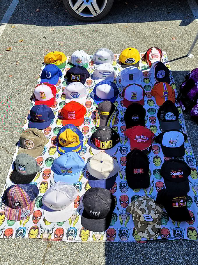 Hat heaven for the nostalgic collector—where vintage sports logos and pop culture references crown tables in a colorful display of wearable memories.
