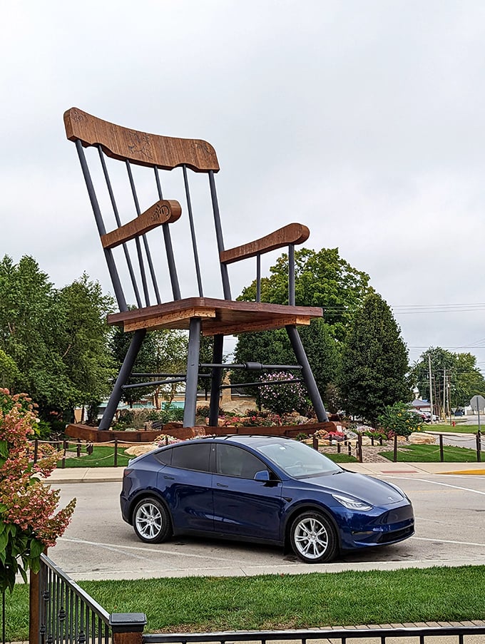 That blue Tesla isn't compensating for anything—it's just trying to find its place in a world suddenly dominated by oversized furniture.