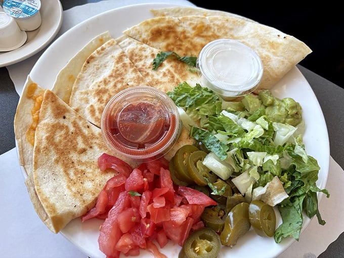 A quesadilla that doesn't just speak Spanish—it sings it, complete with fresh toppings that form a colorful mariachi band.