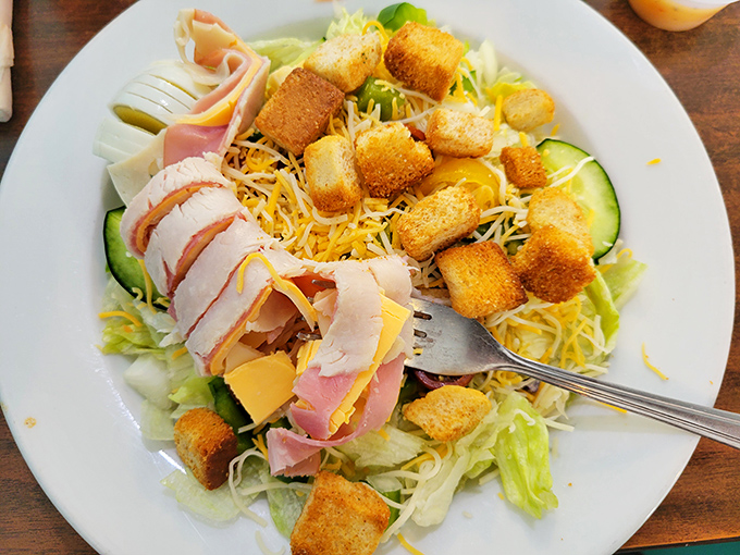 This chef's salad isn't trying to be trendy—it's the reliable friend who shows up with ham, cheese, and perfectly golden croutons when you need them most.