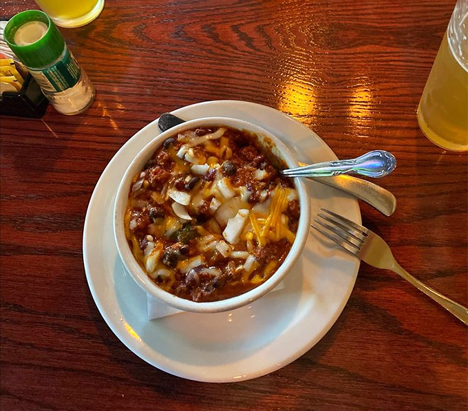 This isn't just chili—it's a warm hug in a bowl, topped with enough cheese to make Wisconsin proud.