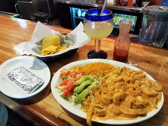 The margarita-shrimp partnership here is like Astaire and Rogers—one brings the kick, the other brings the smooth moves.
