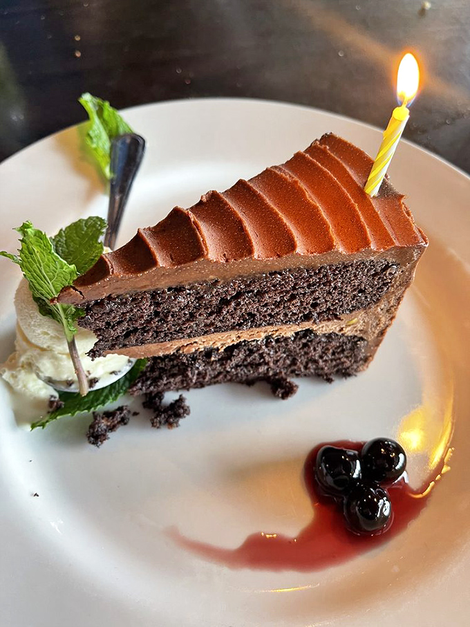 Chocolate cake that makes birthdays jealous. That perfect slice with its berry garnish is worth saving room for.