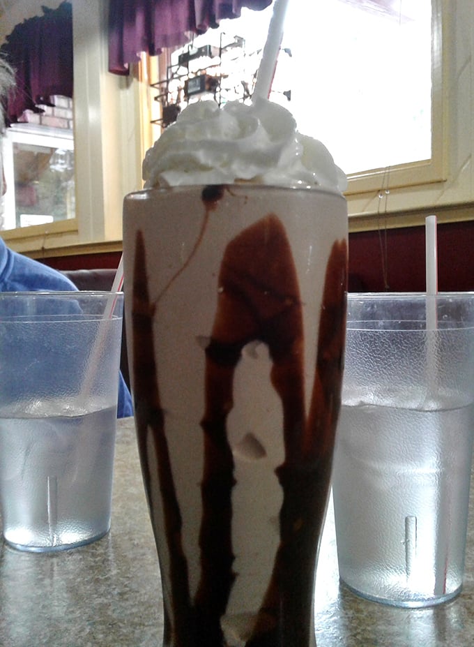Not so much a milkshake as a chocolate revelation in a glass. The straw is merely a suggestion—you'll want a spoon for this masterpiece.