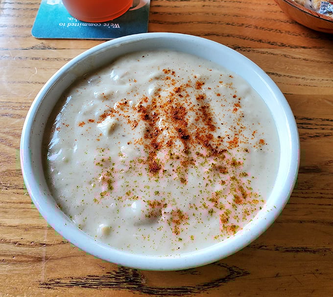 A bowl of creamy clam chowder dusted with spice—comfort food that tastes like the ocean and feels like a warm hug on a cool day.
