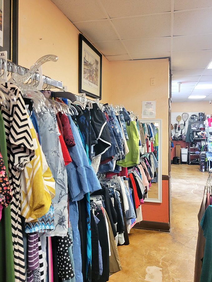 Racks bursting with colorful possibilities. Each garment represents both savings and sustainability in this carefully organized clothing section.