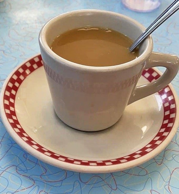The humble diner coffee cup—holder of liquid ambition, keeper of morning dreams, and proof that sometimes the simplest pleasures are the most reliable.