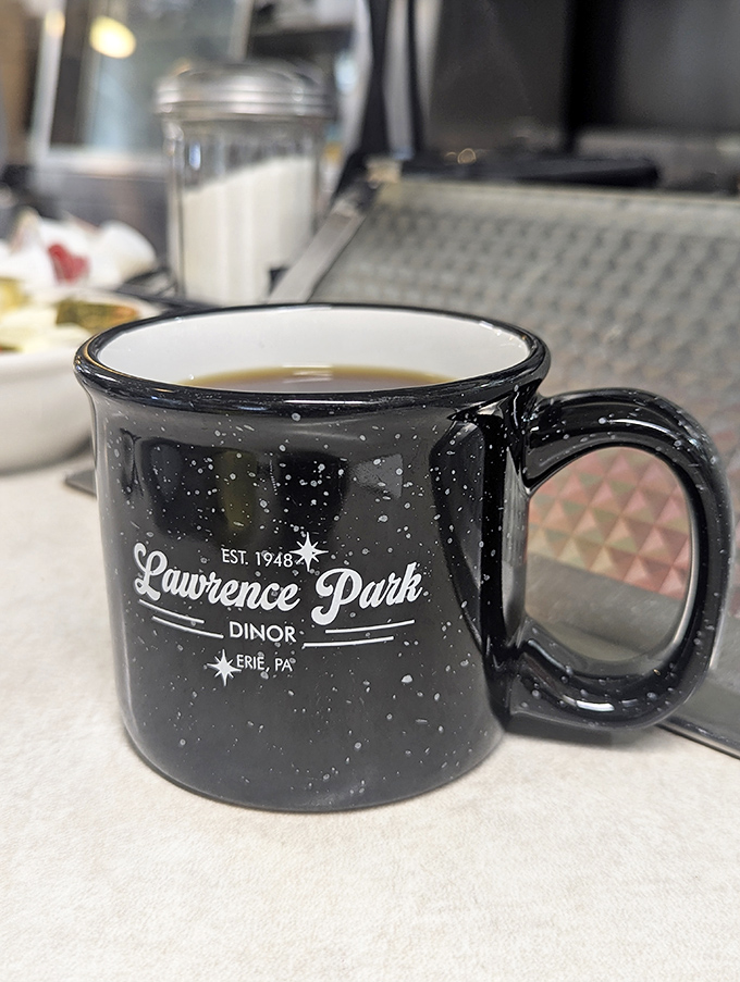 The coffee comes in mugs substantial enough to double as hand-warmers on Erie winter mornings, emblazoned with the diner's heritage like a badge of honor.