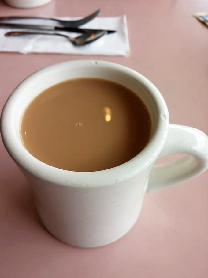 Coffee in a classic diner mug—the original therapy session. No fancy latte art needed when the coffee itself gives you a reason to face the day.