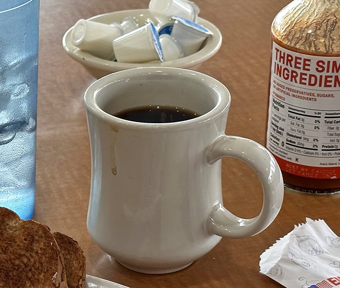 The humble white diner mug—civilization's perfect coffee delivery system. No fancy handles or artisanal glazes, just reliable caffeine transport.