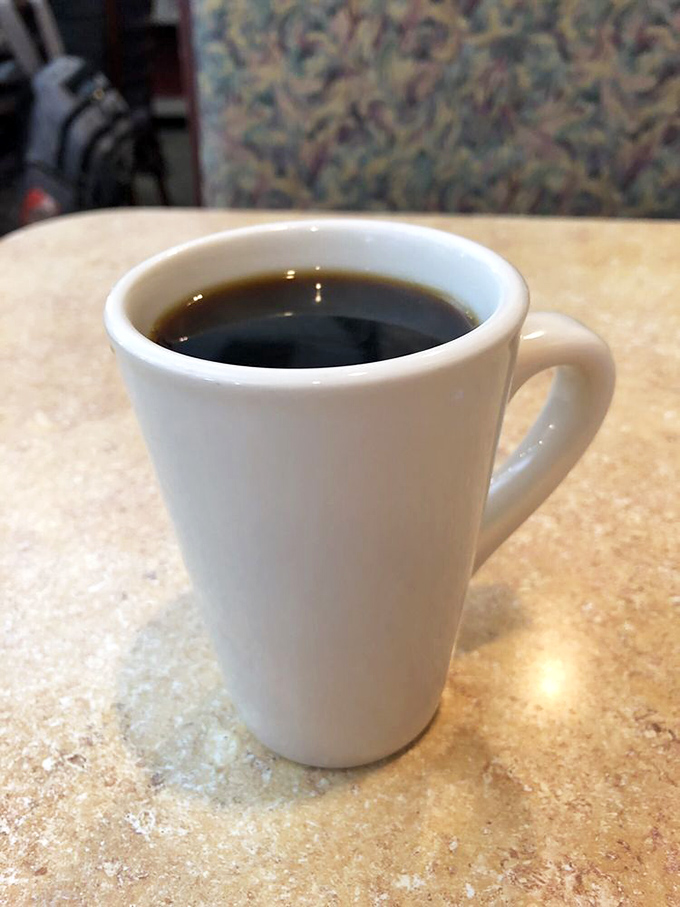 The coffee comes in a proper mug—none of those dainty teacups that leave you begging for refills every three minutes.