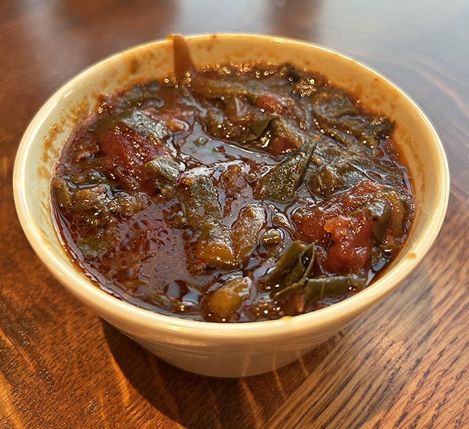 These collard greens have been simmering longer than most Hollywood marriages. Dark, rich, and complex—they're the Robert De Niro of side dishes.