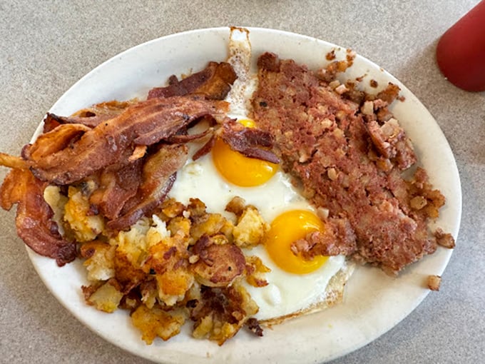 The breakfast of champions—or anyone with a hearty appetite and stretchy pants. Those sunny-side-up eggs are practically winking at you.