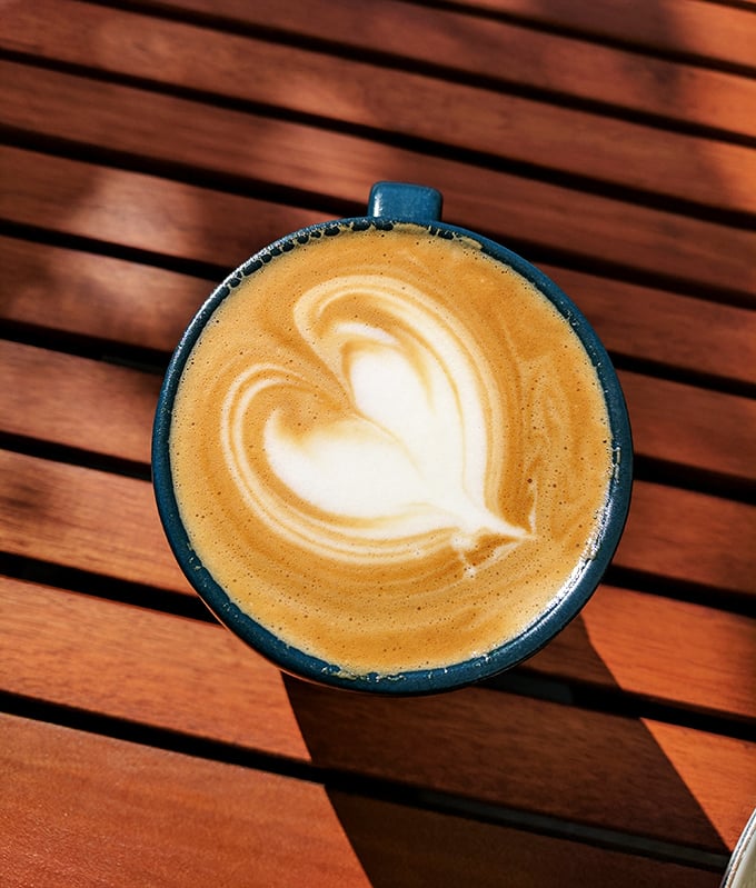 Coffee served with the care of a fine wine. That heart-shaped foam isn't just Instagram bait—it's a promise of the attention to detail throughout your meal.