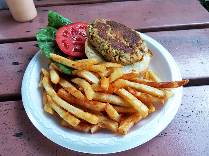 This crab cake sandwich doesn't hide behind fancy garnishes—just pure, sweet crabmeat with a side of perfectly crisp fries.