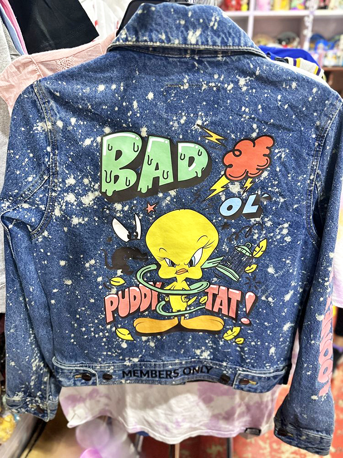This splatter-painted denim jacket featuring Tweety Bird isn't just clothing—it's wearable cartoon history. "I tawt I taw" the perfect vintage find!