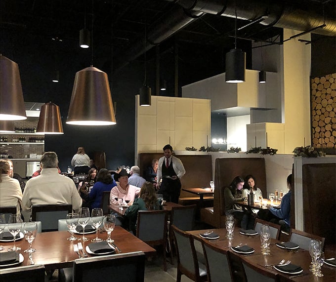 The dining room hums with the universal language of good food—forks pausing mid-air as conversations flow as smoothly as the wine.