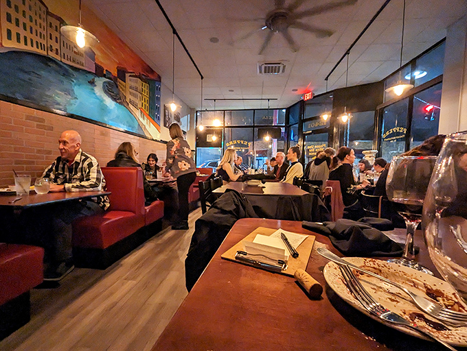 The evening buzz of satisfied diners, clinking glasses, and the warm glow of pendant lights—dinner theater at its most delicious.
