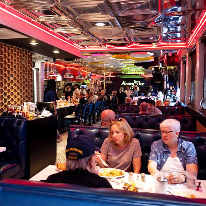 Fellow breakfast pilgrims gathered in vinyl-cushioned bliss, united by their excellent taste in morning destinations.