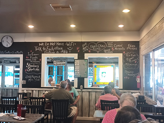 The chalkboard proudly announces "We Do Not Have WiFi—Talk To Each Other," a refreshing reminder that good food and conversation still go hand in hand. 