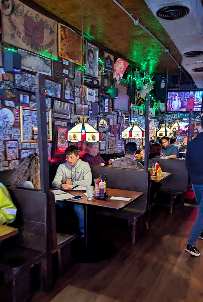 Diners contemplate their massive meals while surrounded by decades of collected American pop culture treasures.