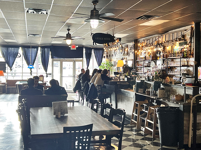 The bar area isn't just serving drinks – it's creating a community where strangers become friends over bourbon and BBQ.
