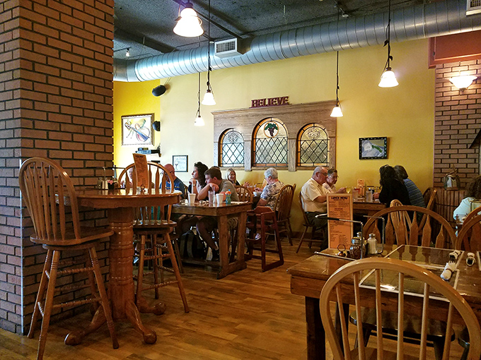 The dining room buzzes with the universal language of satisfied customers. That "BELIEVE" sign isn't just decor—it's a promise about to be fulfilled.