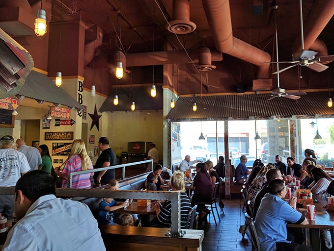 The buzz of happy diners fills this space where strangers become friends over shared barbecue bliss.