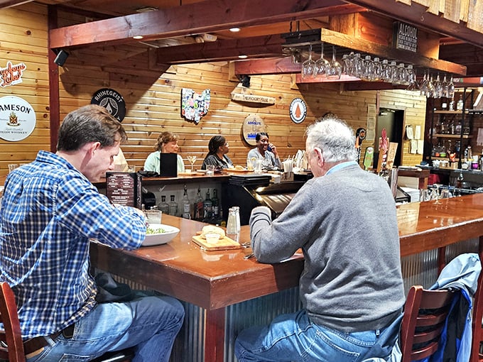 Where locals gather at the bar isn't just about drinks—it's about community. These aren't just patrons; they're unofficial restaurant ambassadors sharing wisdom.