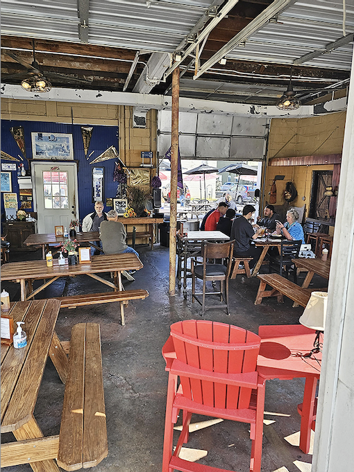 The dining area isn't just a place to eat—it's a community gathering spot where strangers become friends over the universal language of great BBQ.