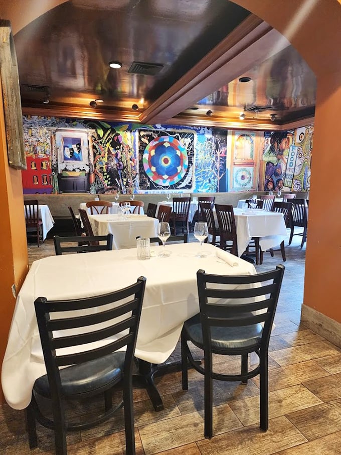 The dining room feels like an artist's loft that fell in love with a fisherman's cottage—colorful walls showcasing art that's as eclectic as the menu.